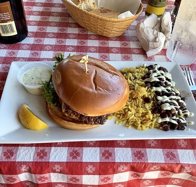 This isn't just a sandwich; it's Florida on a bun. Blackened mahi with all the fixings and those black beans? Pure coastal comfort.