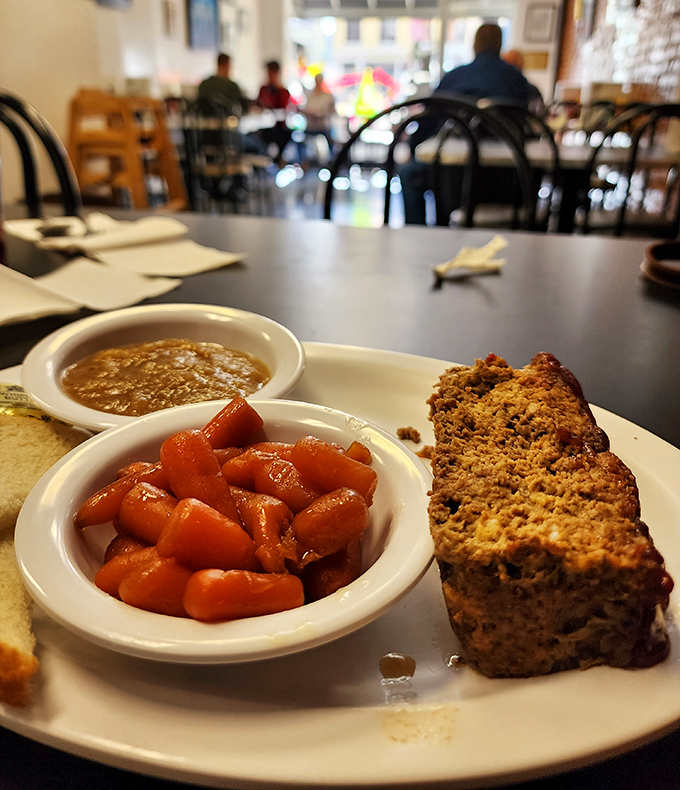 Comfort on a plate: homestyle meatloaf with candied carrots. Some come for the burgers, but regulars know the full depth of Hinkle's menu.