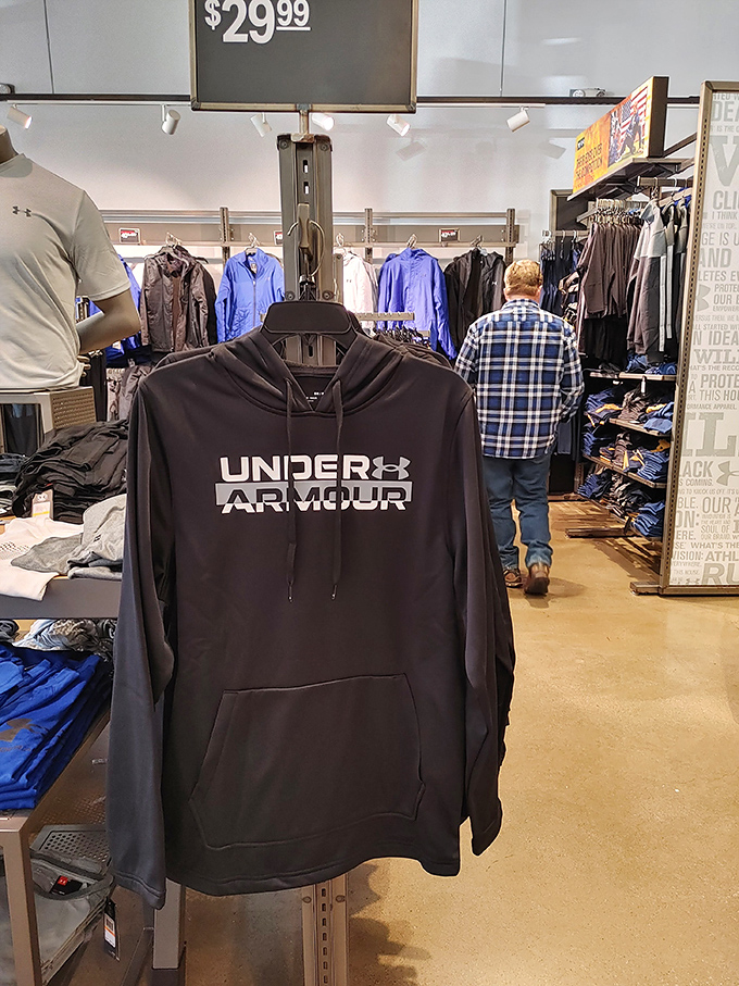 Under Armour hoodies promise athletic excellence, even if your most strenuous activity involves walking between outlet stores all afternoon.
