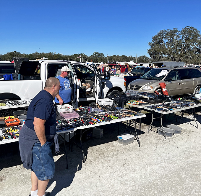 The tailgate entrepreneur's dream setup. Where else can you find pocket knives, collectible lighters, and mysterious gadgets whose purposes remain delightfully unclear?