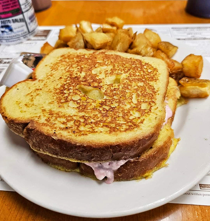 The Monte Cristo sandwich&mdash;where French toast meets ham and cheese in a marriage so perfect it should have its own reality show. Those home fries are the ideal supporting cast.