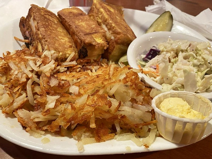 The Monte Cristo sandwich with golden hash browns and creamy coleslaw&mdash;proof that sometimes the best things in life are fried, stacked, and served with a pickle.