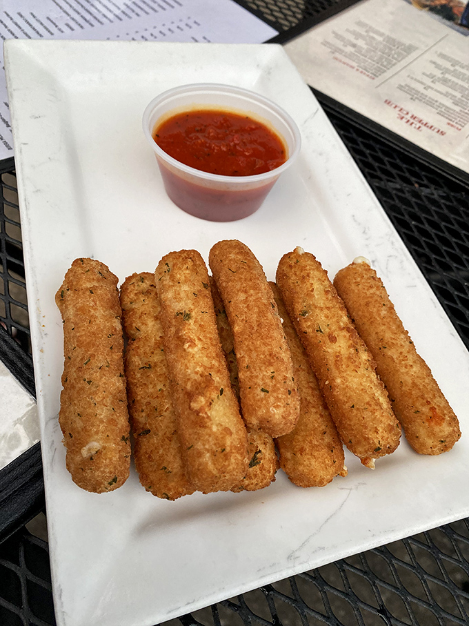 These aren't your freezer-aisle mozzarella sticks. Each golden rod delivers that perfect cheese pull worthy of a slow-motion video.