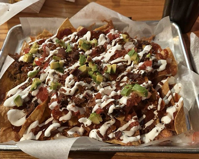 BBQ nachos that redefine excess in the best possible way. Tortilla chips become the lucky recipients of multiple smoked meats, fresh toppings, and sauces that'll make you forget traditional nachos ever existed.