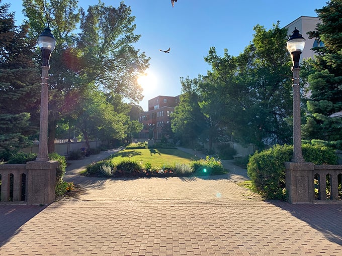 Norumbega Parkway's sun-dappled brick path offers a tranquil urban oasis where birdsong competes with distant city whispers.