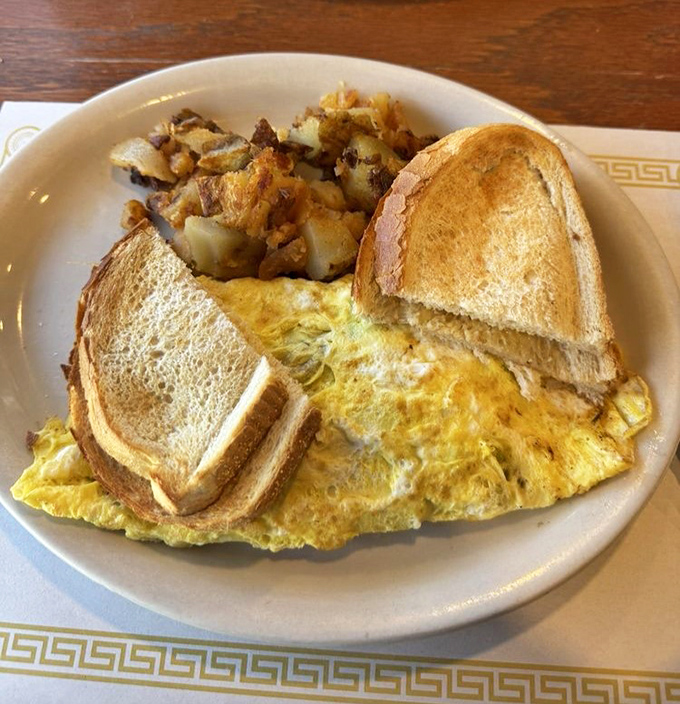 An omelet that refuses to be ordinary. Perfectly folded and generously filled, it's the breakfast equivalent of a warm hug.