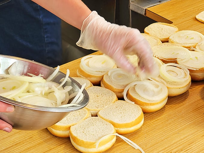 The onion prep station reveals the secret behind great burgers: attention to detail. Like a conductor arranging musicians, each slice is positioned for maximum flavor impact.