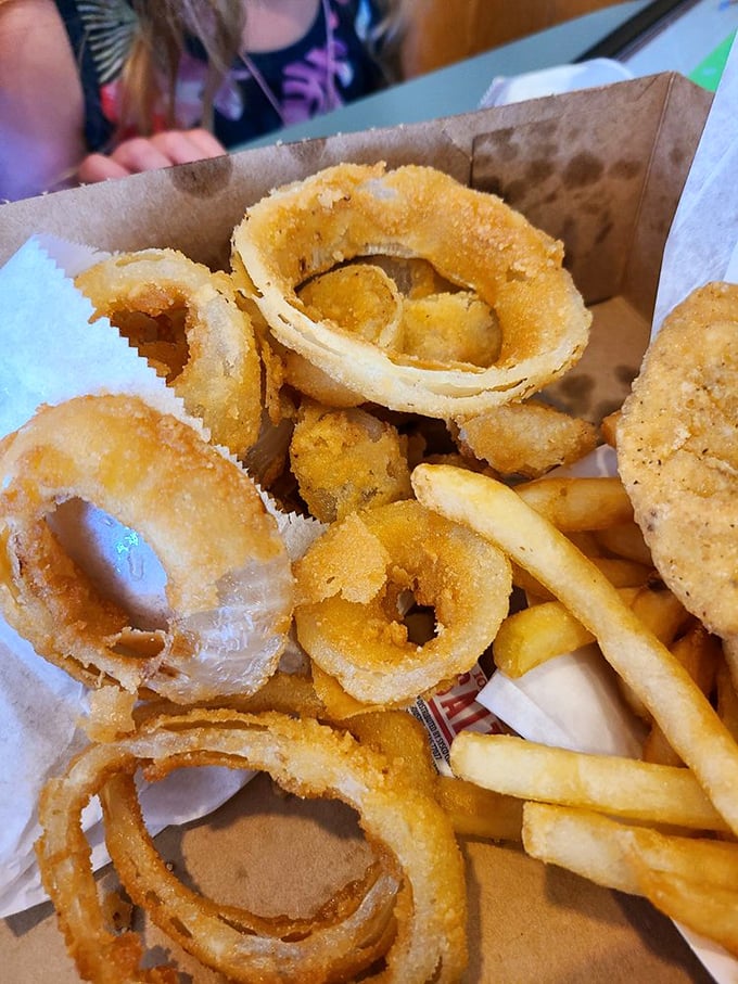 Golden, crispy onion rings and fries that make you question why anyone would bother with truffle oil or fancy seasonings.