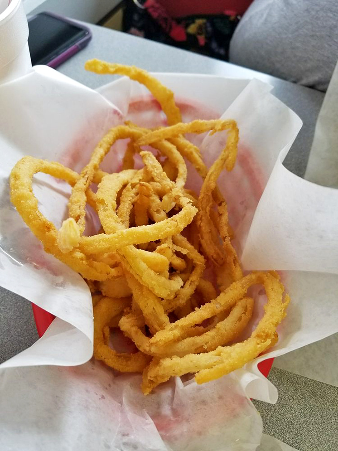 These onion rings aren't just side dishes—they're golden halos of happiness. Crispy, light, and worth every napkin you'll need afterward.