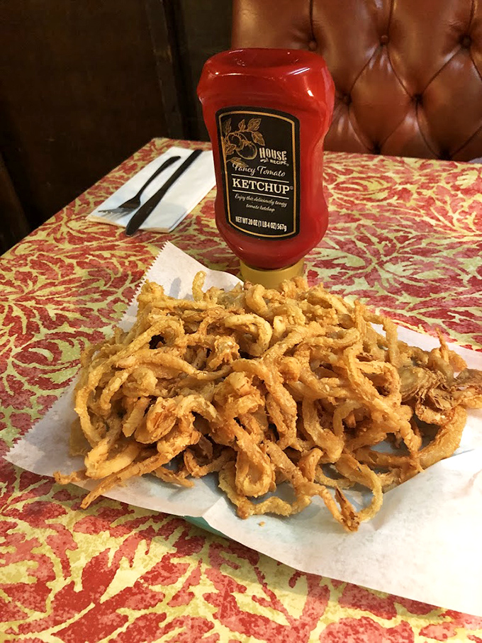 These onion rings aren't just a side dish – they're crispy, golden halos deserving of their own fan club and fancy ketchup.