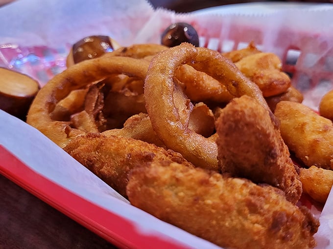 These golden-battered onion rings aren't just appetizers &ndash; they're edible halos that make you question why anyone would ever eat vegetables any other way.