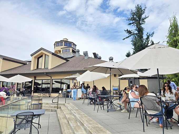 Umbrella-shaded tables offer front-row seats to the most spectacular wine country views imaginable.