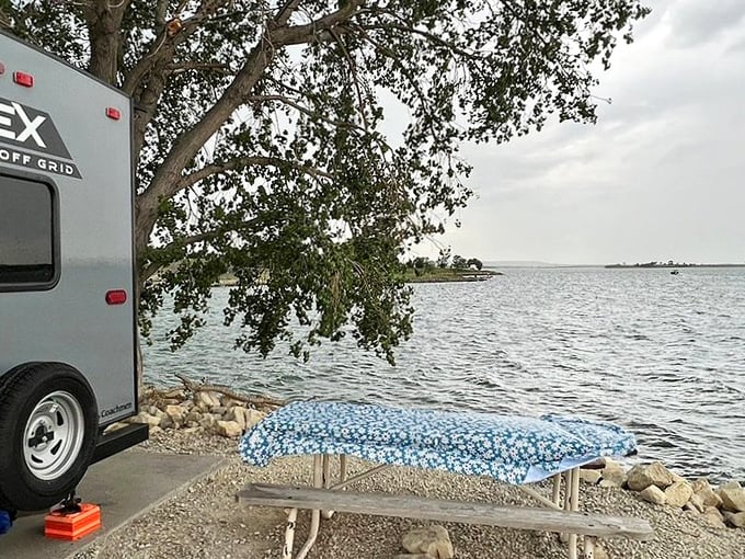 Front-row seats to nature's greatest show. This lakeside picnic spot transforms ordinary sandwiches into gourmet meals with that million-dollar view.