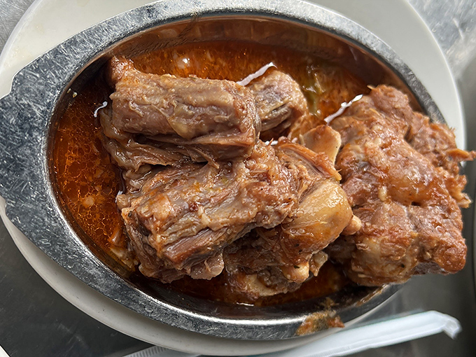 Oxtail stew so tender it practically surrenders to your fork, swimming in a sauce worth bottling and taking home to meet your family.