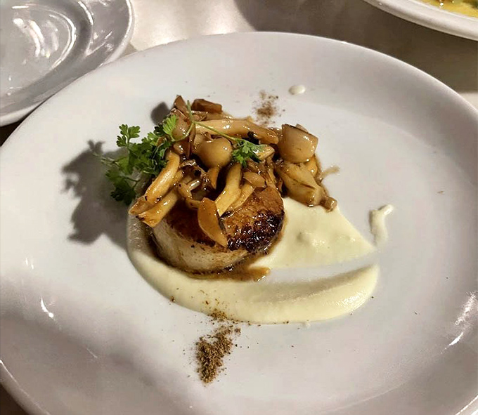 This perfectly seared scallop isn't just dinner&mdash;it's a masterclass in restraint, with those wild mushrooms playing the perfect supporting role.
