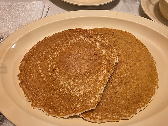 Pancakes that don't need Instagram filters or fancy toppings. Golden-brown, plate-sized, and ready to soak up maple syrup like they were born for it.