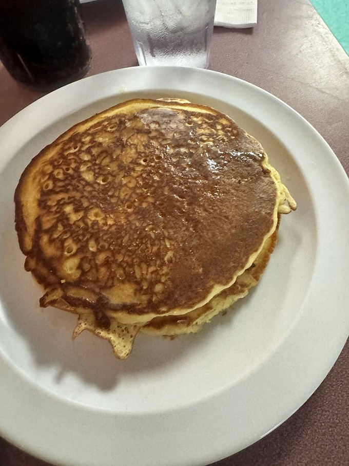 Golden, crispy-edged pancakes that somehow manage to be both fluffy and substantial – the breakfast equivalent of a warm hug.