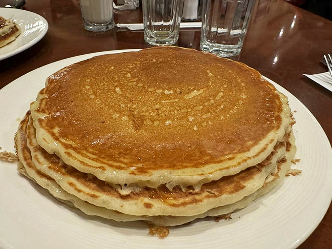 These aren't just pancakes; they're fluffy golden discs of happiness that have probably prevented more Los Angeles arguments than therapy.