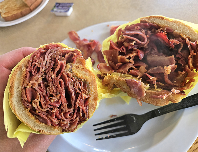 The pastrami sandwich&mdash;a monument to meat artistry. Thinly sliced, perfectly seasoned, and piled high enough to make your cardiologist wince and your taste buds applaud.