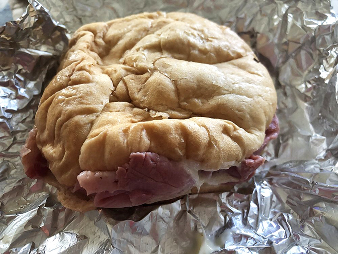 The pastrami sandwich doesn't need New York's approval, but it would certainly get it. Pink, peppery perfection nestled in a pillowy roll.