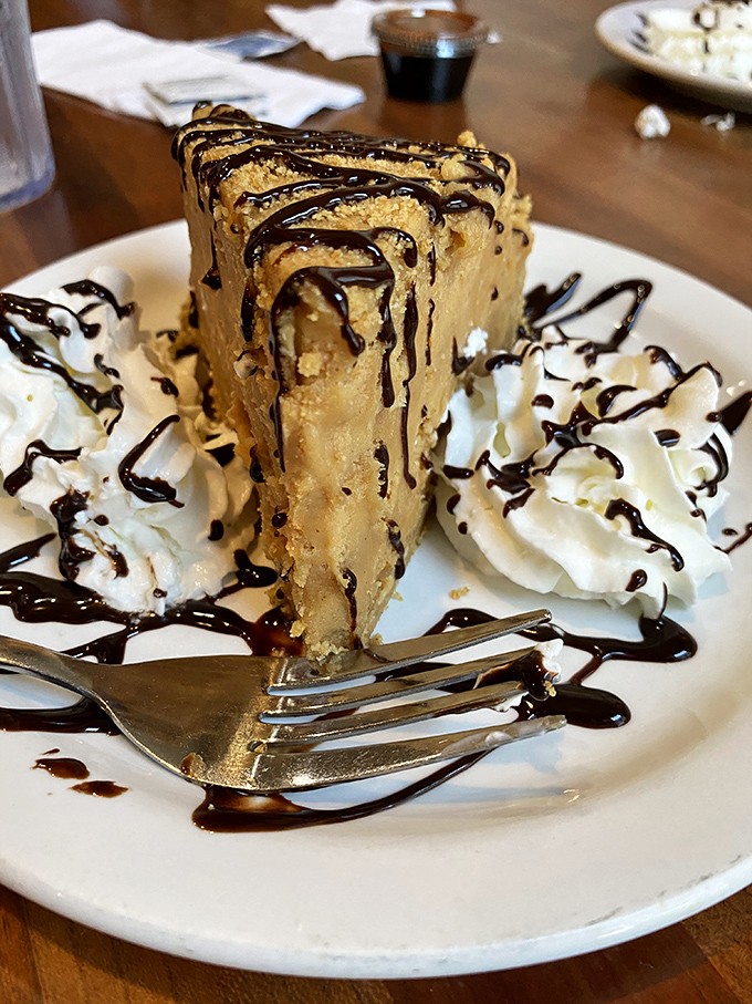 This towering slice of peanut butter paradise could make even your strictest diet take a vacation day.
