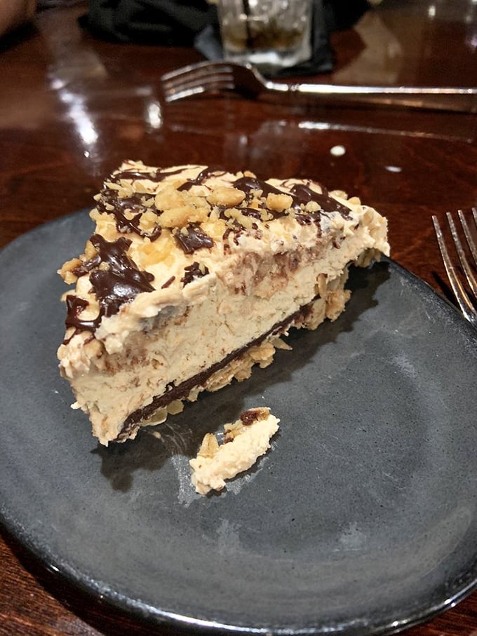 Peanut butter pie that would make Elvis weep with joy. The chocolate drizzle and crushed nuts aren't toppings&mdash;they're the crown jewels.