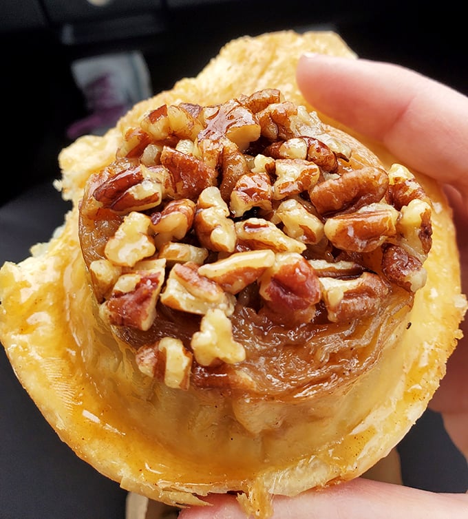 The sticky bun's caramelized pecan topping glistens like nature's candy, proving that sometimes the best things in life are gloriously messy.