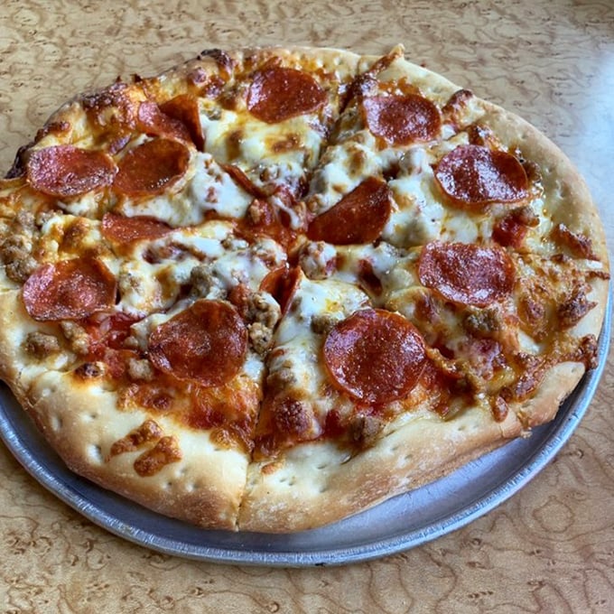 Crispy pepperoni curling at the edges like they're trying to escape the perfectly melted cheese. No one's breaking out of this flavor lockdown.