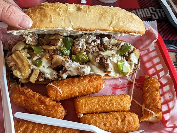 The Philly meets Ohio in this sandwich showdown. Those mozzarella sticks on the side aren't just appetizers&mdash;they're the opening act for a flavor concert.