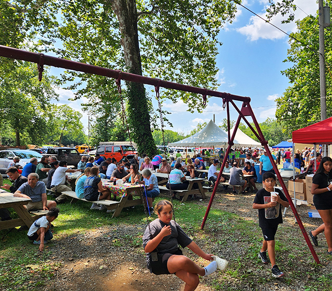 The market's social hub, where treasure hunters refuel under shade trees and compare their finds between bites of local fare.