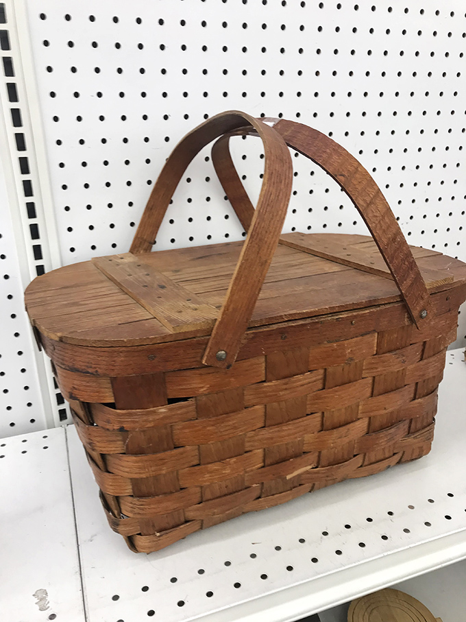 A vintage picnic basket that's seen more potlucks than you've had hot dinners. Wicker never goes out of style.