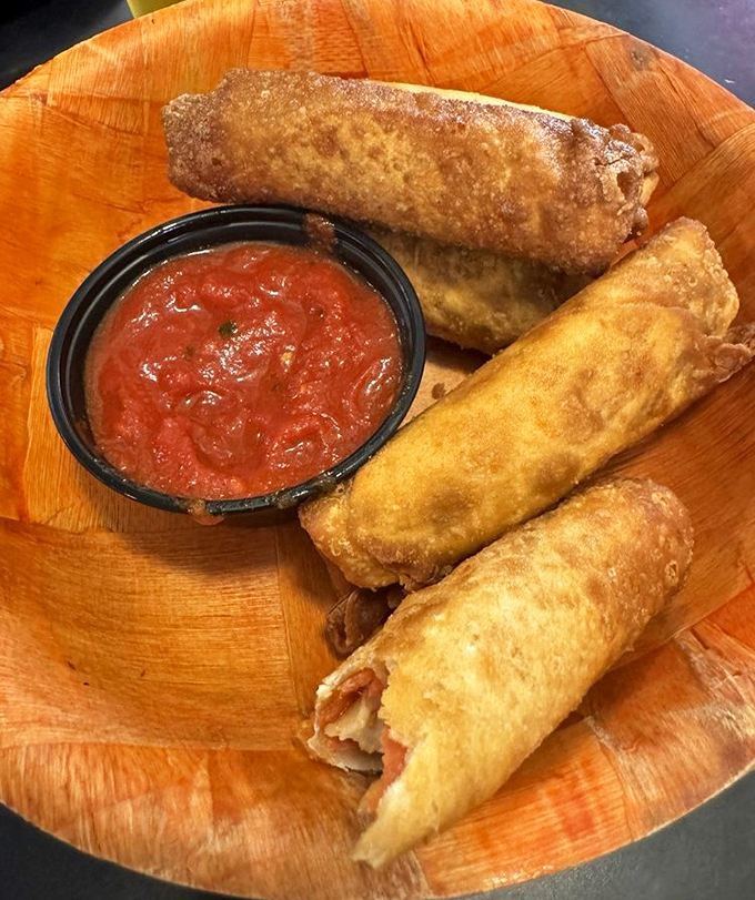 Golden-fried pizza logs waiting for their marinara bath. Crispy on the outside, molten cheese and pepperoni within&mdash;pure comfort food genius.