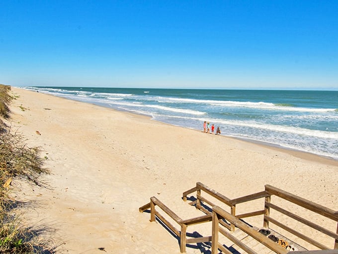 Playalinda Beach stretches endlessly, where your biggest decision is which direction to walk toward paradise.