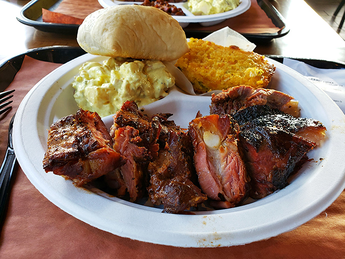 Not just a plate of food but a work of art&mdash;smoky meat, creamy sides, and a roll that's ready to soak up every last drop of flavor.