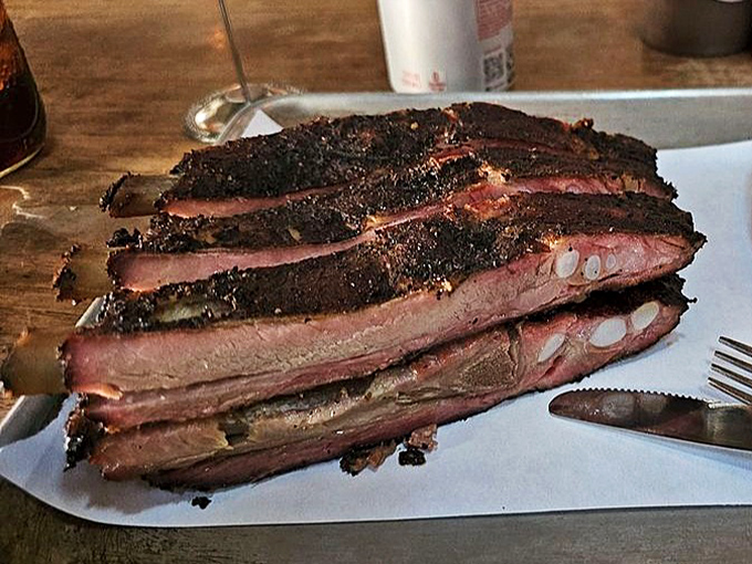 Pork ribs with a bark so beautiful it deserves its own gallery showing, tender enough to make vegetarians reconsider everything.