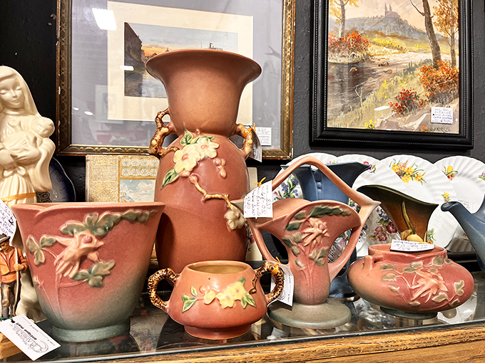 These blush-colored pottery pieces don't just hold flowers; they hold the artistic sensibilities of an era when craftsmanship trumped mass production.