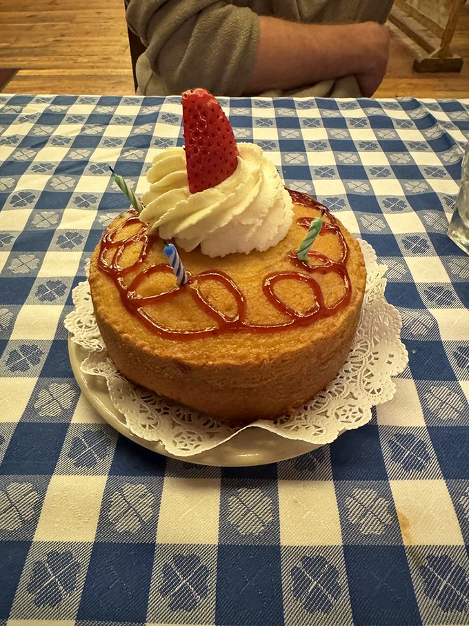 This pound cake isn't just dessert, it's architecture. The strawberry stands guard like a delicious sentinel over caramel rivers.