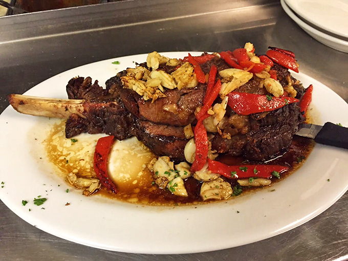 This isn't just prime rib; it's a carnivorous masterpiece topped with roasted peppers and garlic that would make a vegetarian weep.