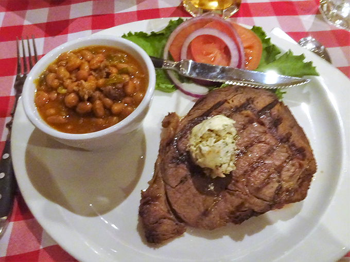 A prime rib that would make Fred Flintstone jealous, served with beans that have clearly been given the respect they deserve.