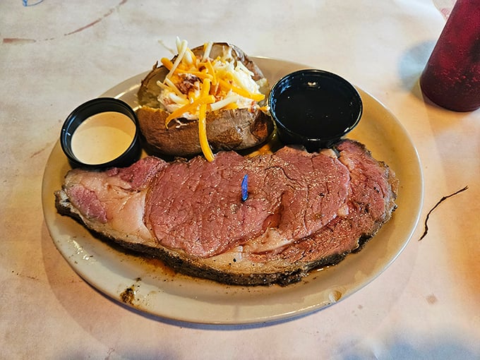 Prime rib that's more tender than a love letter, served with a loaded baked potato that's practically begging to be your dinner's co-star.