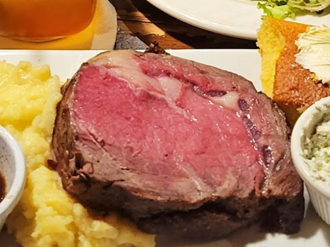 The prime rib arrives perfectly pink, a carnivore's dream that would make even the Sheriff of Nottingham put aside his grudges for another bite.