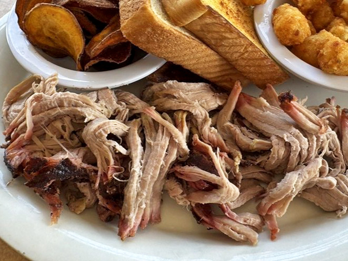 Pulled pork so tender it practically pulled itself. Paired with those homestyle sides, it's a plate of Southern comfort with Florida flair.