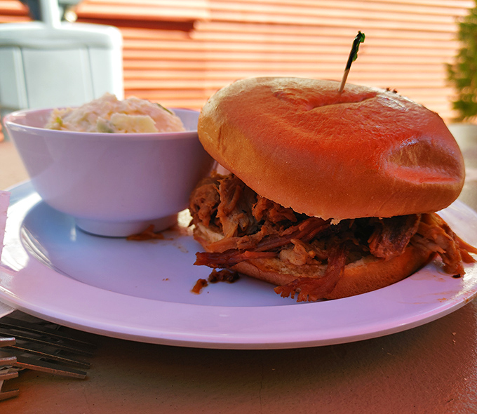 The pulled pork sandwich doesn't need fancy frills&mdash;just a soft bun barely containing a mountain of tender, shredded pork and a side of creamy slaw.