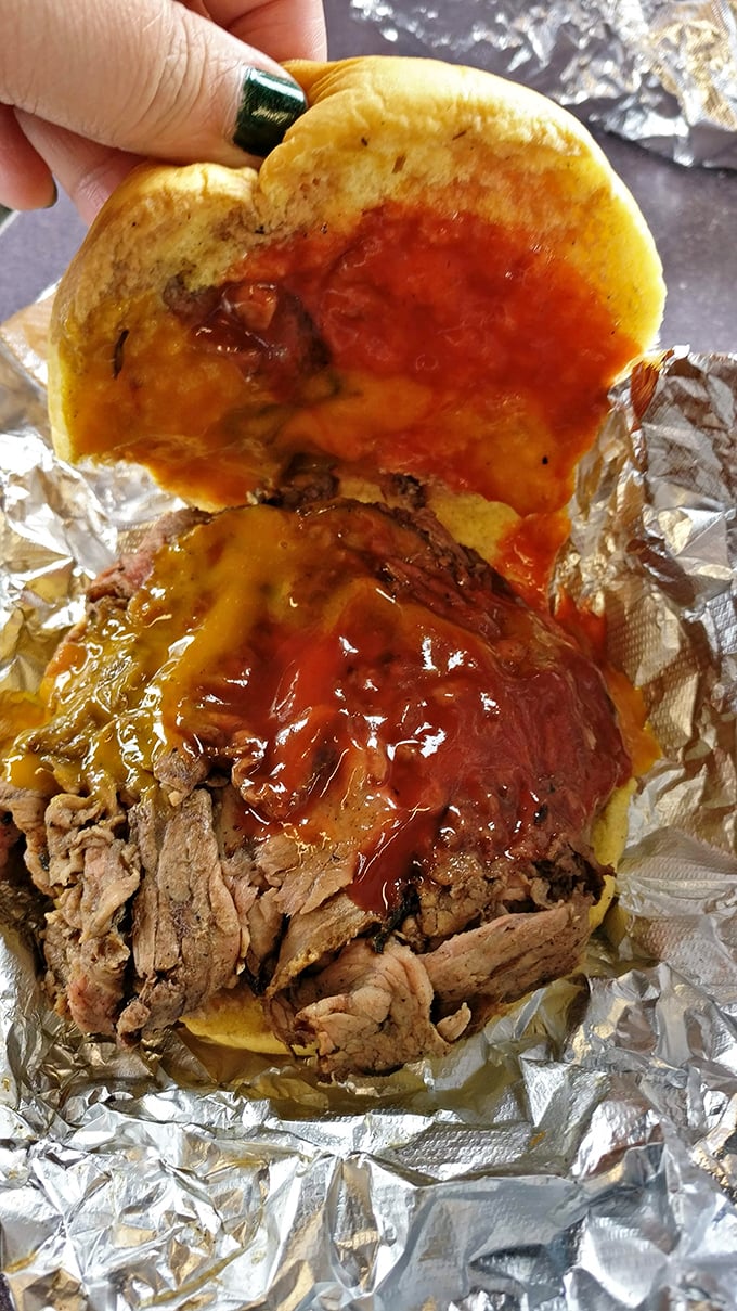 BBQ sauce: nature's most perfect condiment. This pulled pork sandwich demonstrates why sometimes the messiest foods are life's greatest pleasures.