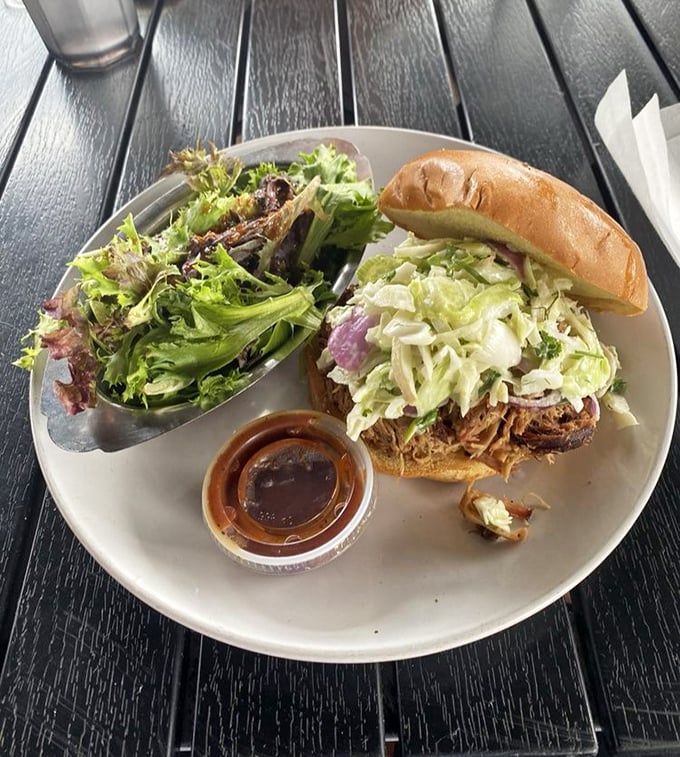 Pulled pork piled high with coleslaw&mdash;proof that sometimes the classics just need perfect execution, not reinvention.