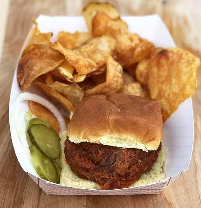 The pulled pork sandwich&mdash;a perfect meat-to-bun ratio that should be studied in culinary schools. Those house-made chips aren't just sidekicks.