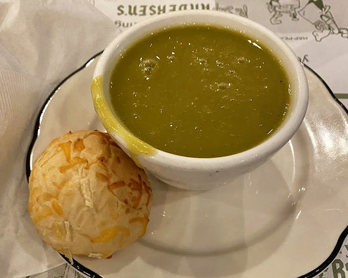 The famous pea soup arrives with a cheese roll sidekick. This vibrant green bowl of comfort has sustained California road-trippers longer than most marriages.