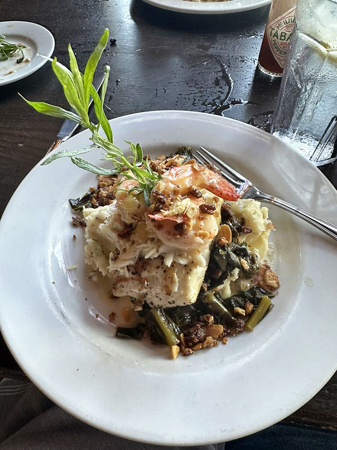 Red snapper meets collard greens in a dish that bridges worlds &ndash; proof that surf and turf can coexist in perfect harmony.