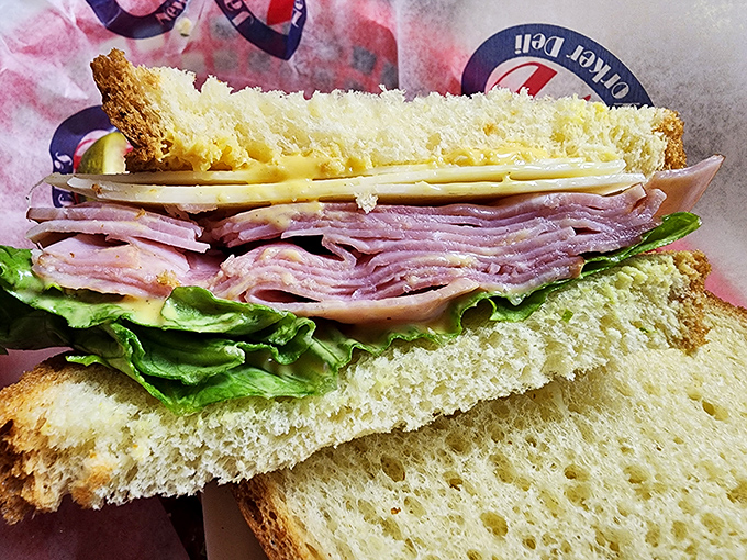 Layer upon glorious layer of ham, cheese, and fresh lettuce&mdash;this sandwich architecture deserves its own feature in Architectural Digest: Lunch Edition.