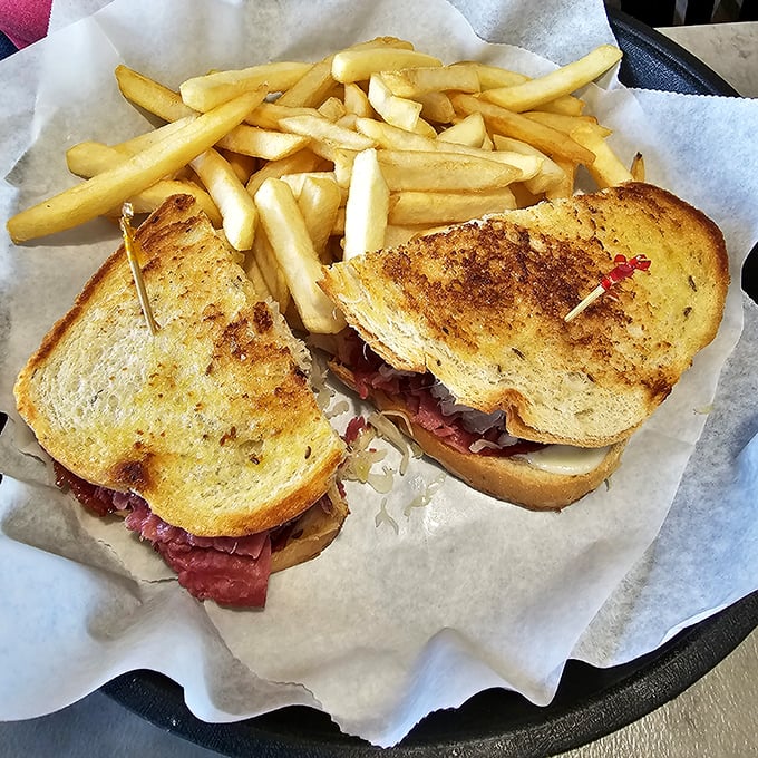 A proper Reuben requires engineering as much as cooking—perfectly balanced, structurally sound, and destined to disappear in record time.